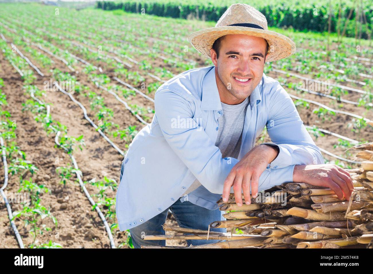 Portrait of positive hired worker on farm field on day Stock Photo - Alamy