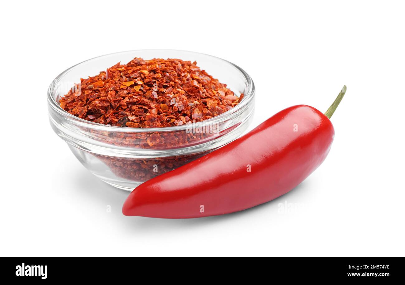 Bowl of chipotle chili flakes on white background Stock Photo - Alamy