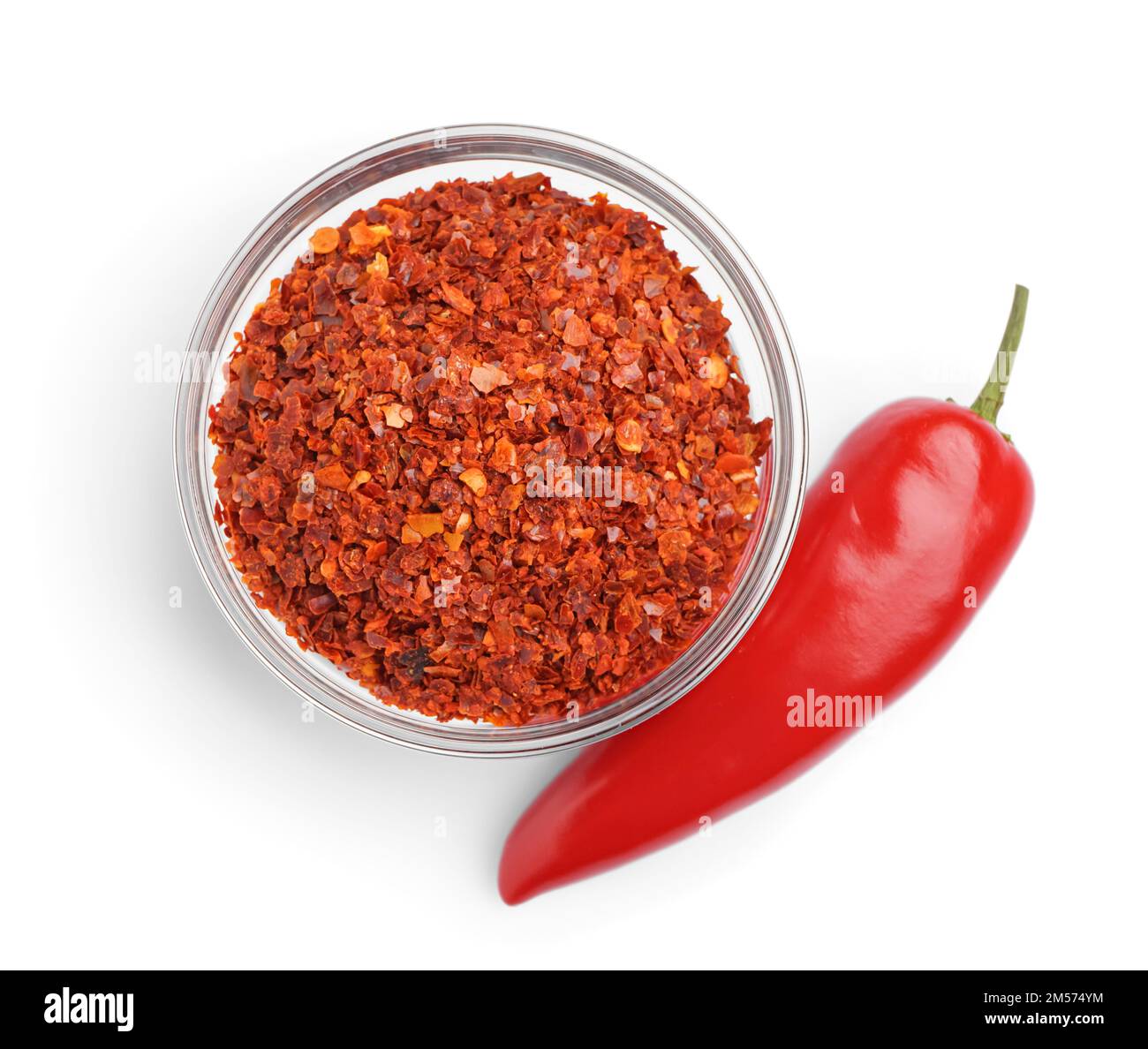 Bowl of chipotle chili flakes on white background Stock Photo - Alamy