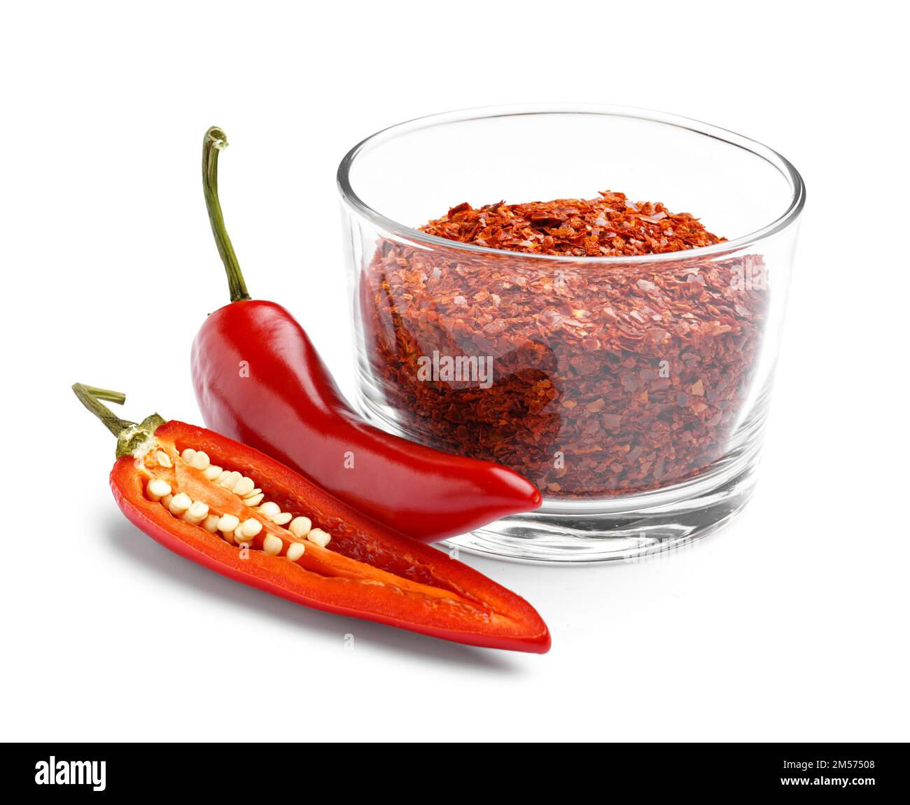 Glass bowl of chipotle chili flakes on white background Stock Photo - Alamy
