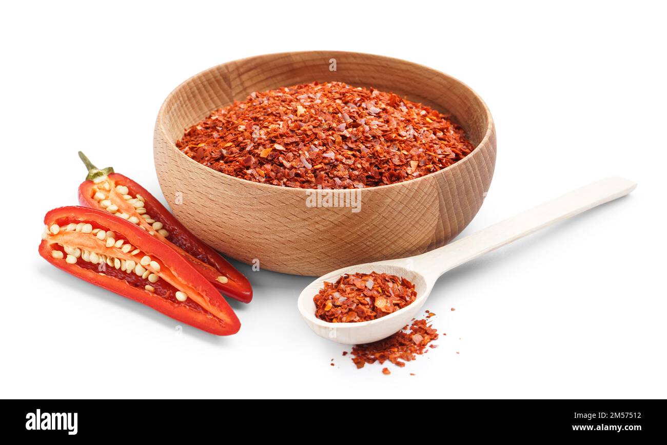 Wooden bowl of chipotle chili flakes on white background Stock Photo ...