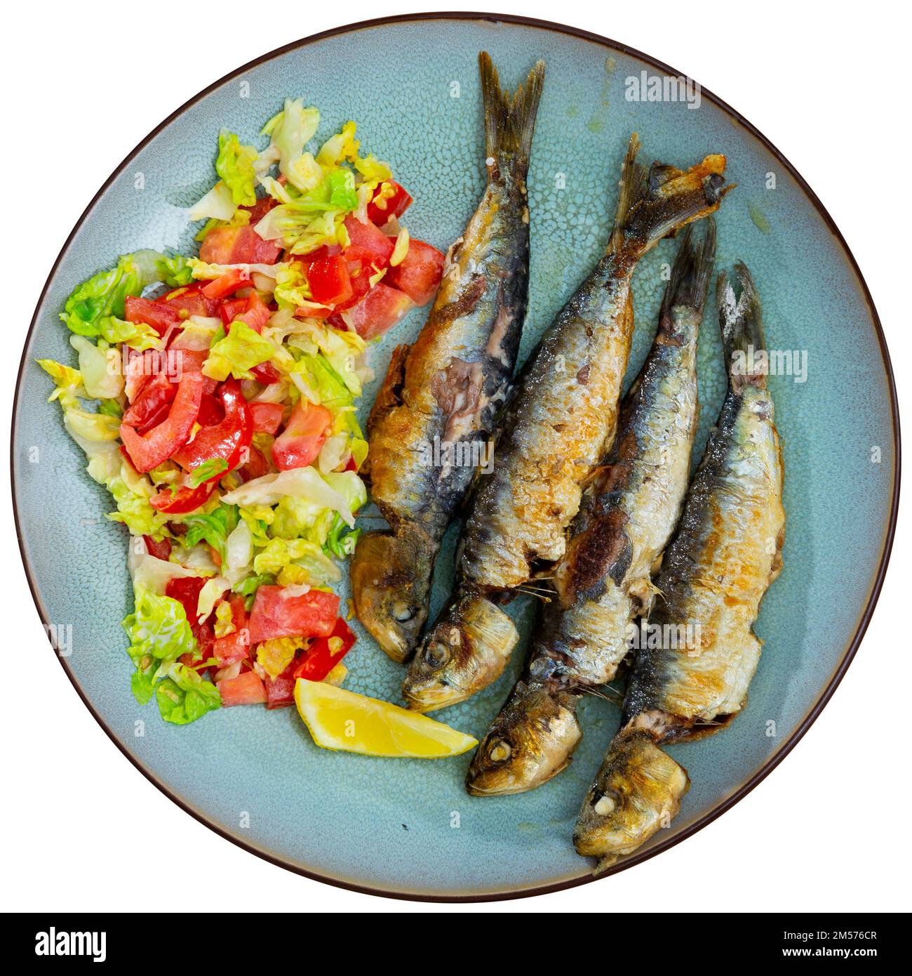 Fried sardines isolated over white background Stock Photo - Alamy