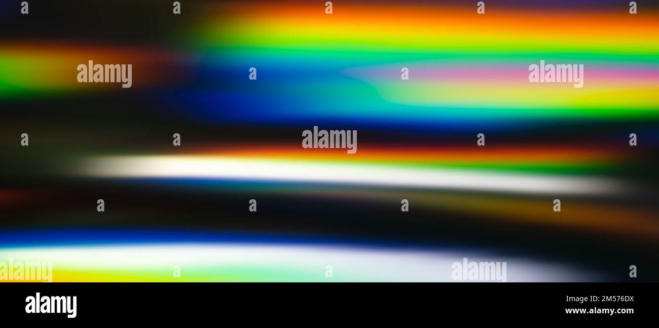 Holographic abstract background with colorful light rays moving fast ...