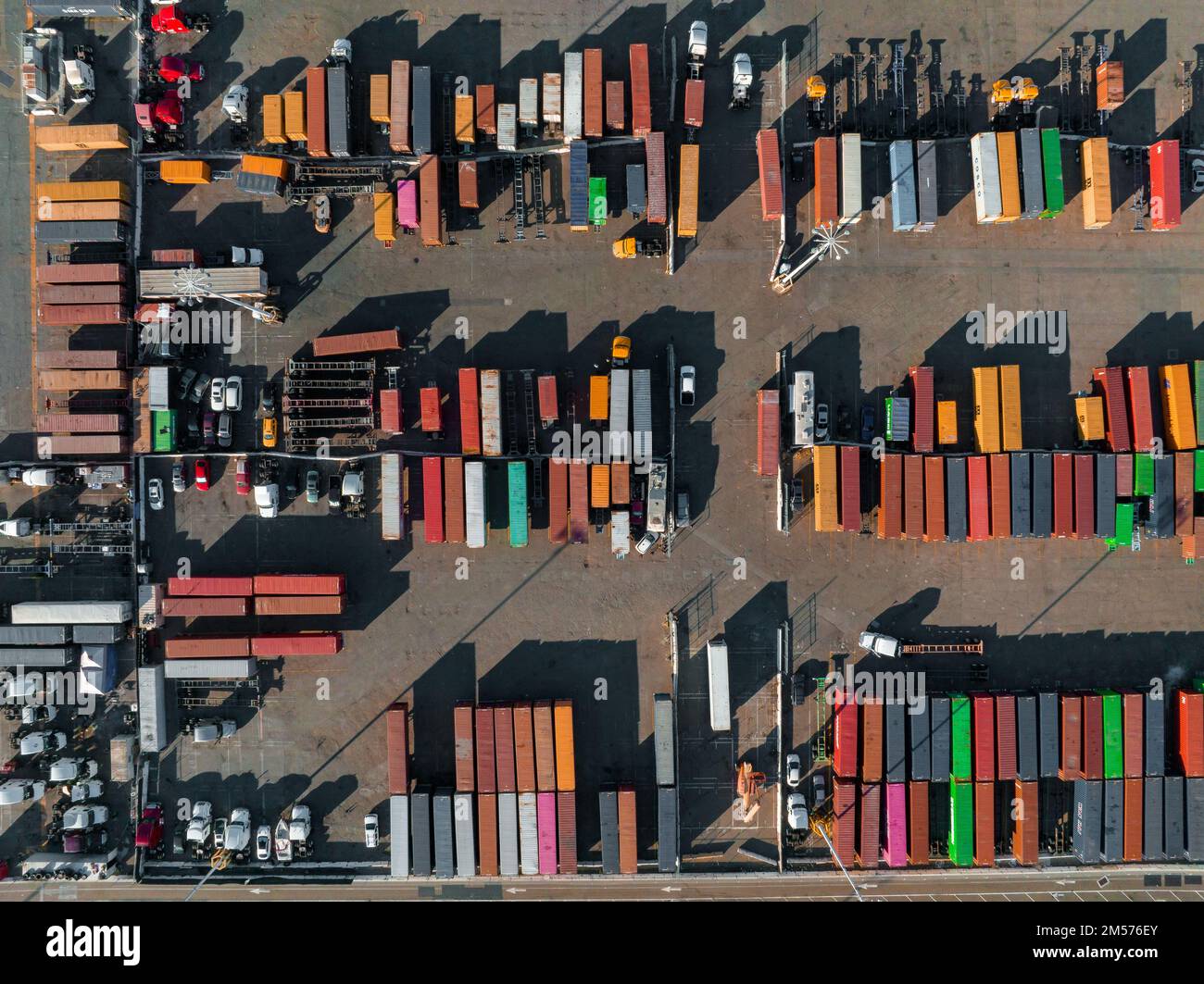 The Oakland Outer Harbor aerial view. Loaded trucks moving by Container cranes Stock Photo - Alamy