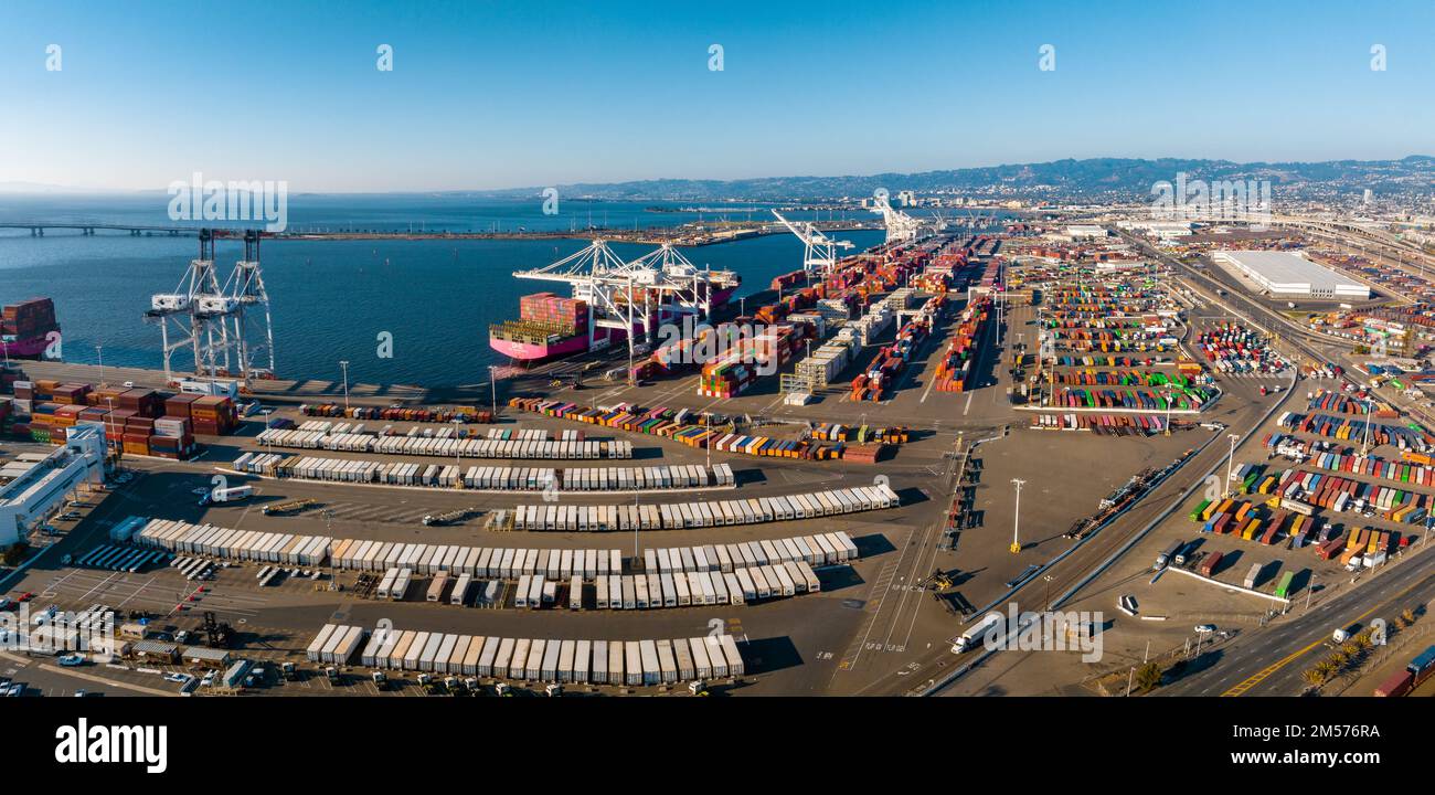 The Oakland Outer Harbor aerial view. Loaded trucks moving by Container cranes Stock Photo - Alamy
