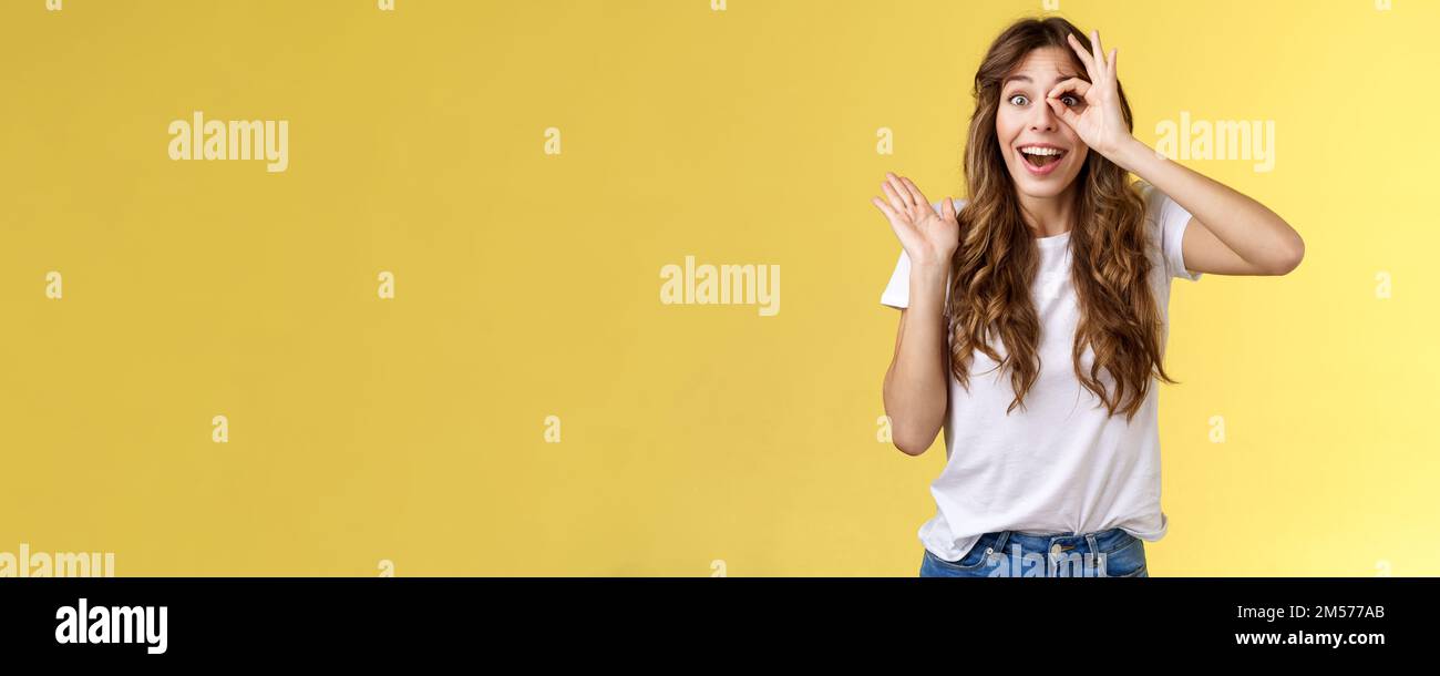 Oh hi I see you. Fascinated cute charming young girl waving palm say ...