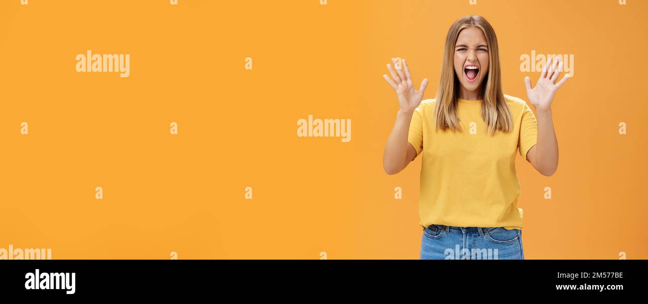 Woman releasing stress yelling with joy and pleasure gesturing with ...