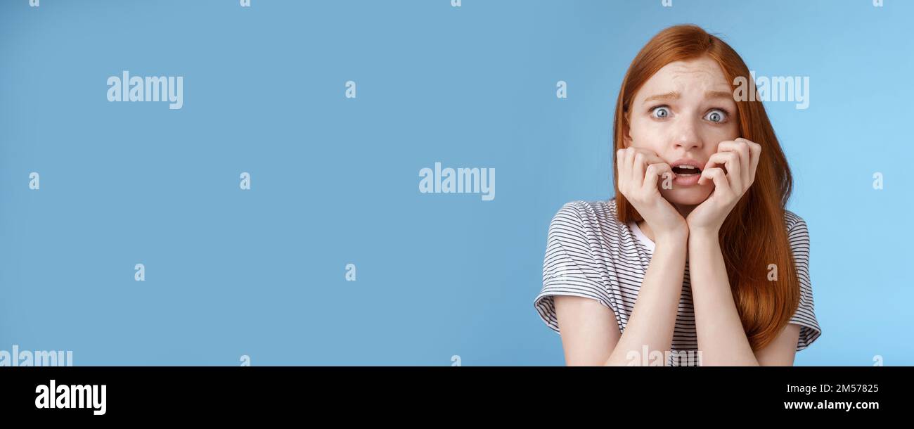 Scared speechless stunned frightened redhead girl trembling fear wide ...