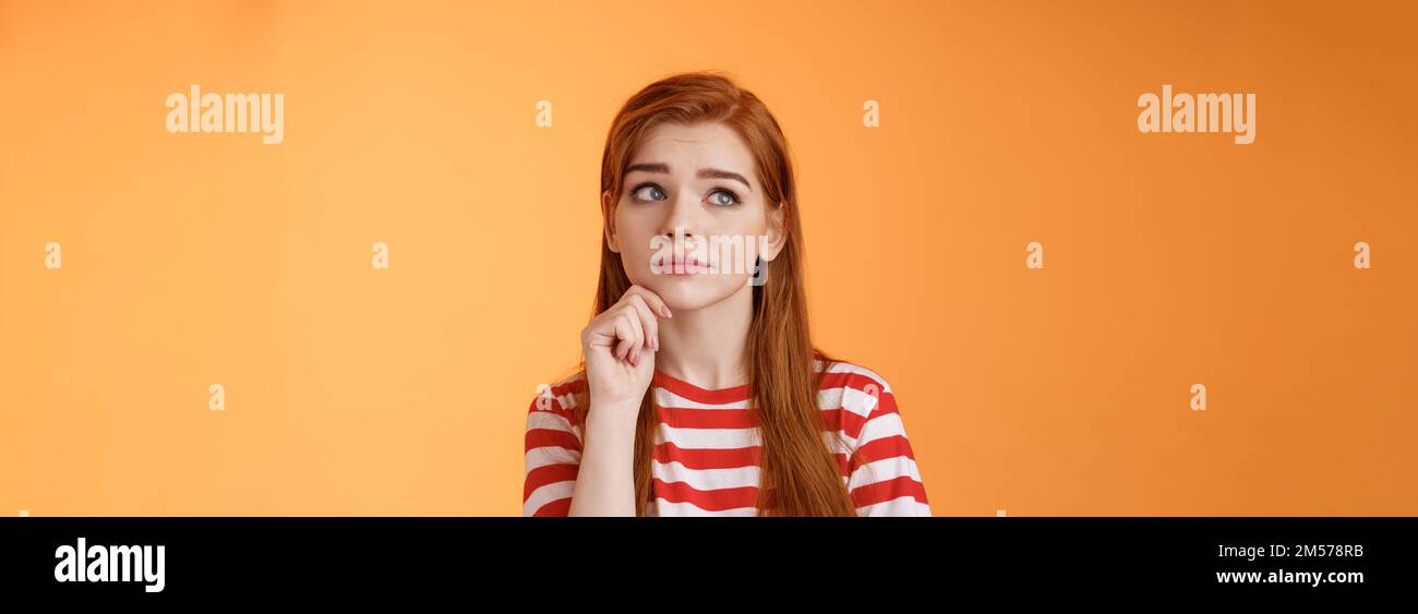 Close-up uneasy cute redhead female student facing tough troublesome ...