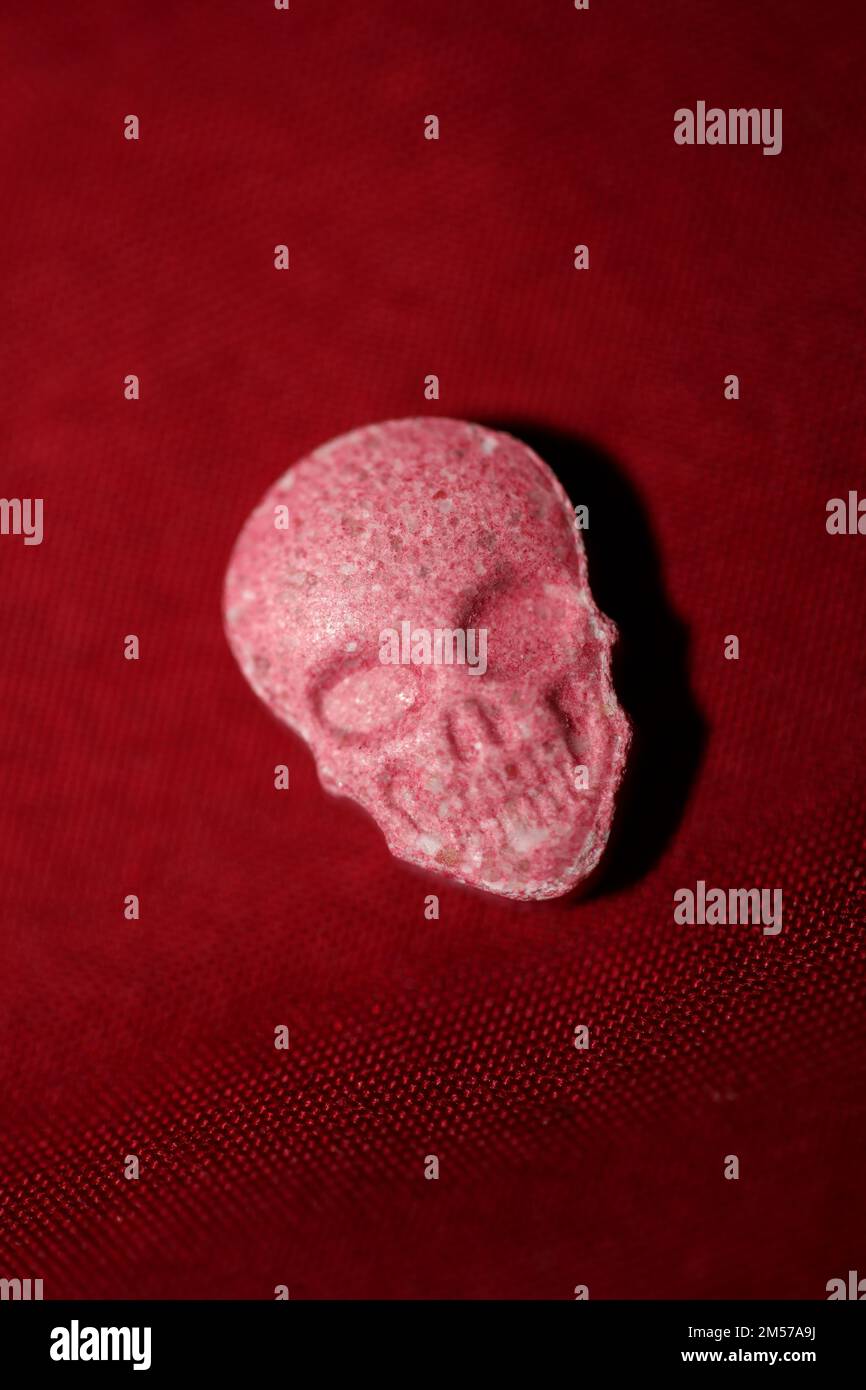 Purple skull world's strongest ecstasy pills close up background high ...