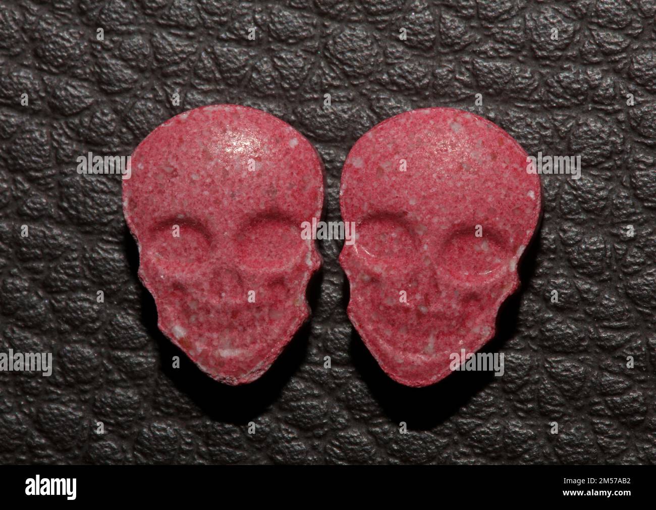Purple skull world's strongest ecstasy pills close up background high ...