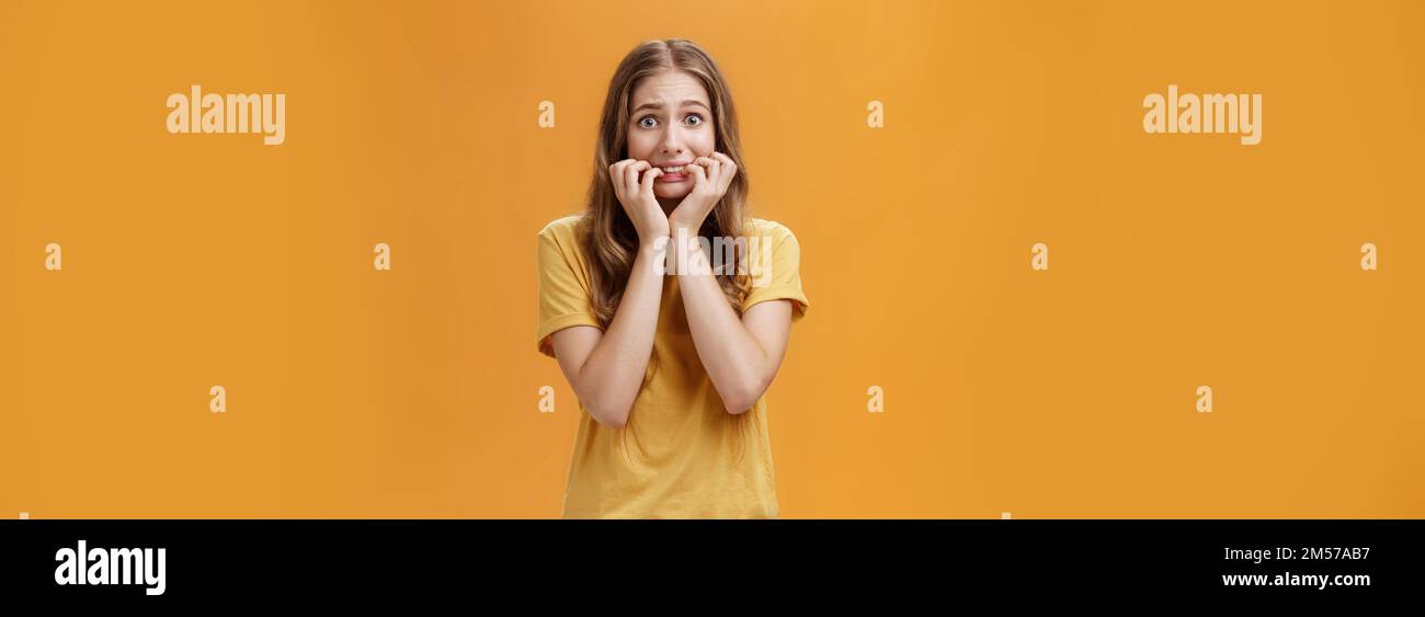 Portrait of paniching nervous silly insecure young woman feeling scared ...