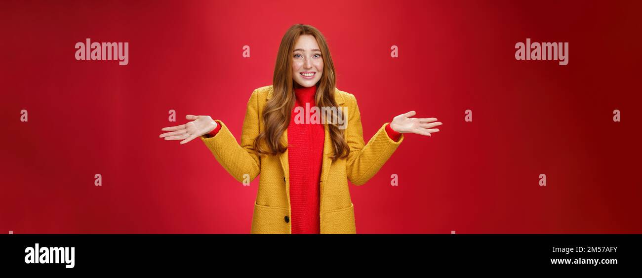 Redhead girl apologizes for being late smiling silly and guilty with ...