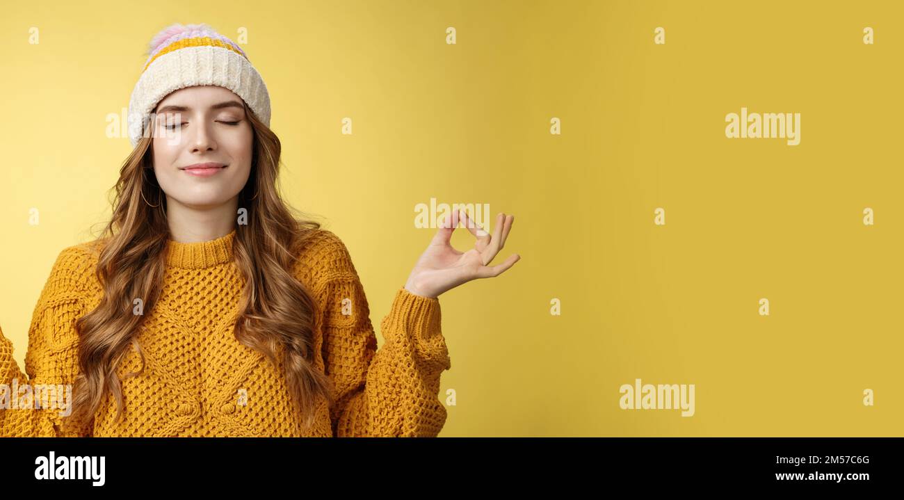 Keep calm carry on. Portrait relieved happy meditating charming young ...