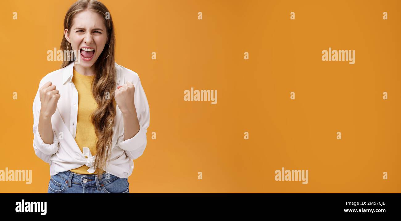 Girl feeling power overcome any trouble yelling to cheer up and boost ...