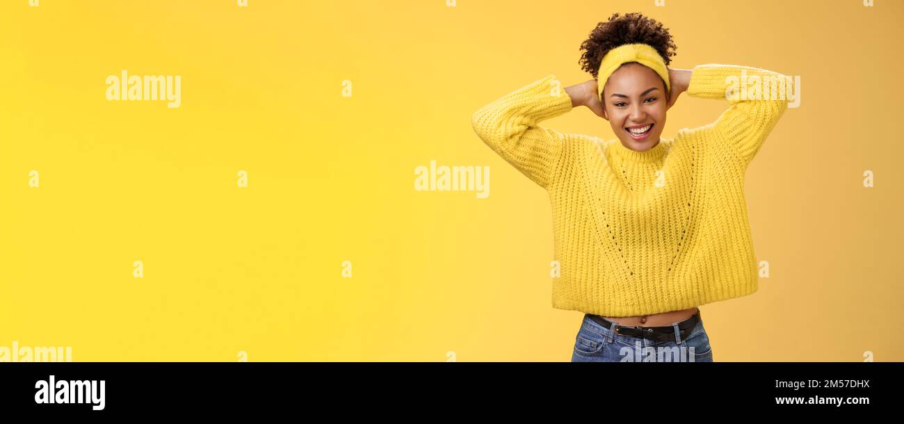 Attractive lucky optimistic african-american woman having fun lay back ...
