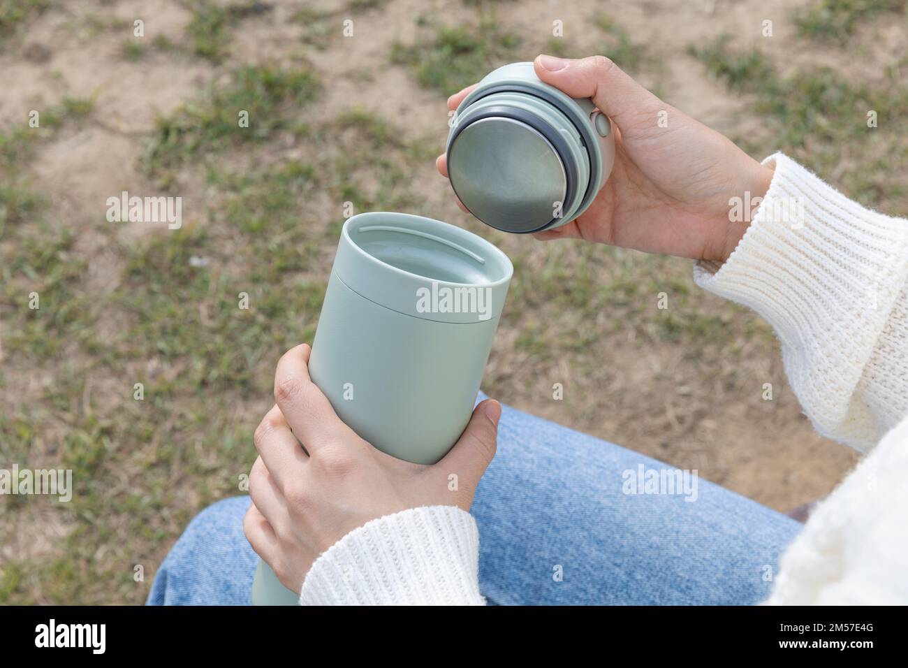 eco friendly habits hand gesture using tumbler Stock Photo - Alamy