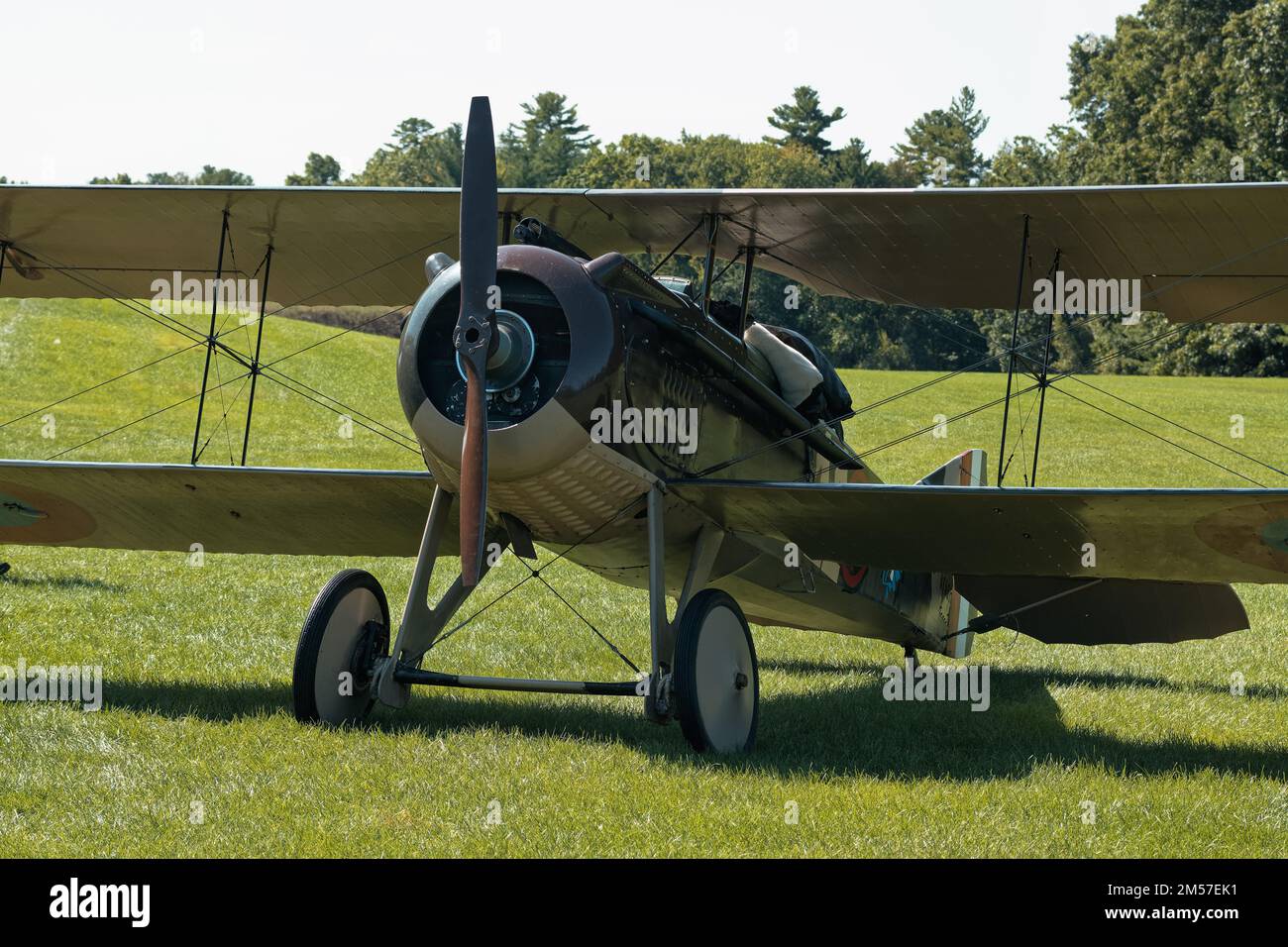 A 1914 French WWI Nieuport 11 biplane flying maneuvers during a war reenactment performance at ...