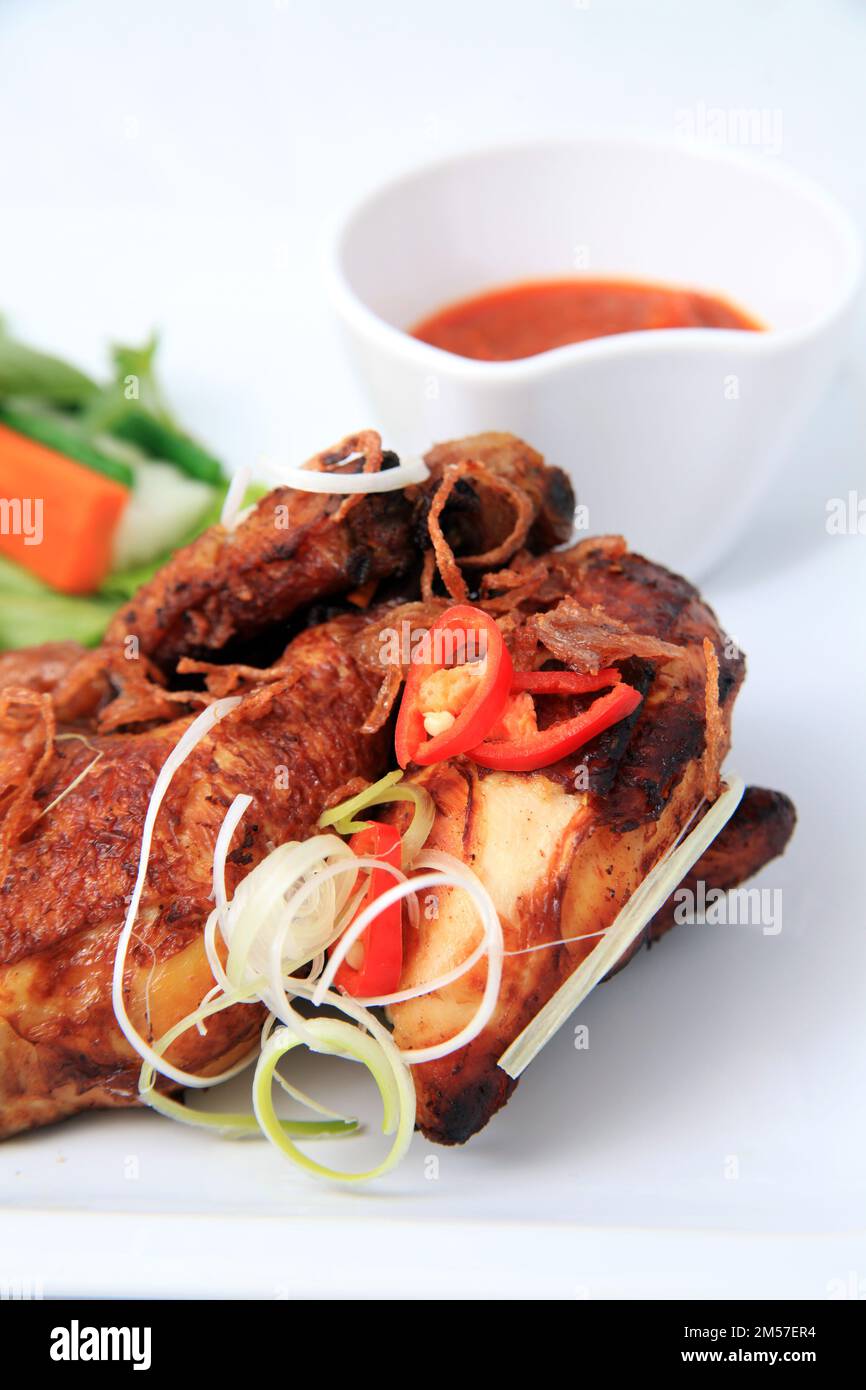 big size traditional fried chicken portion with hot chili sauce with ...