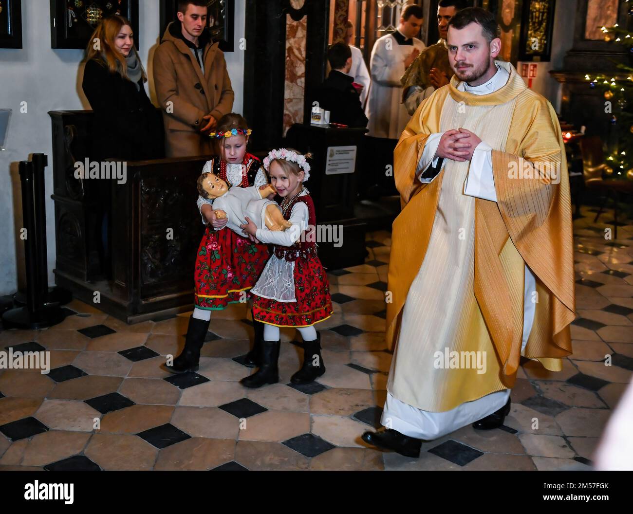 Krakow, Poland. 25th Dec, 2022. The figure of Baby Jesus carried by two ...