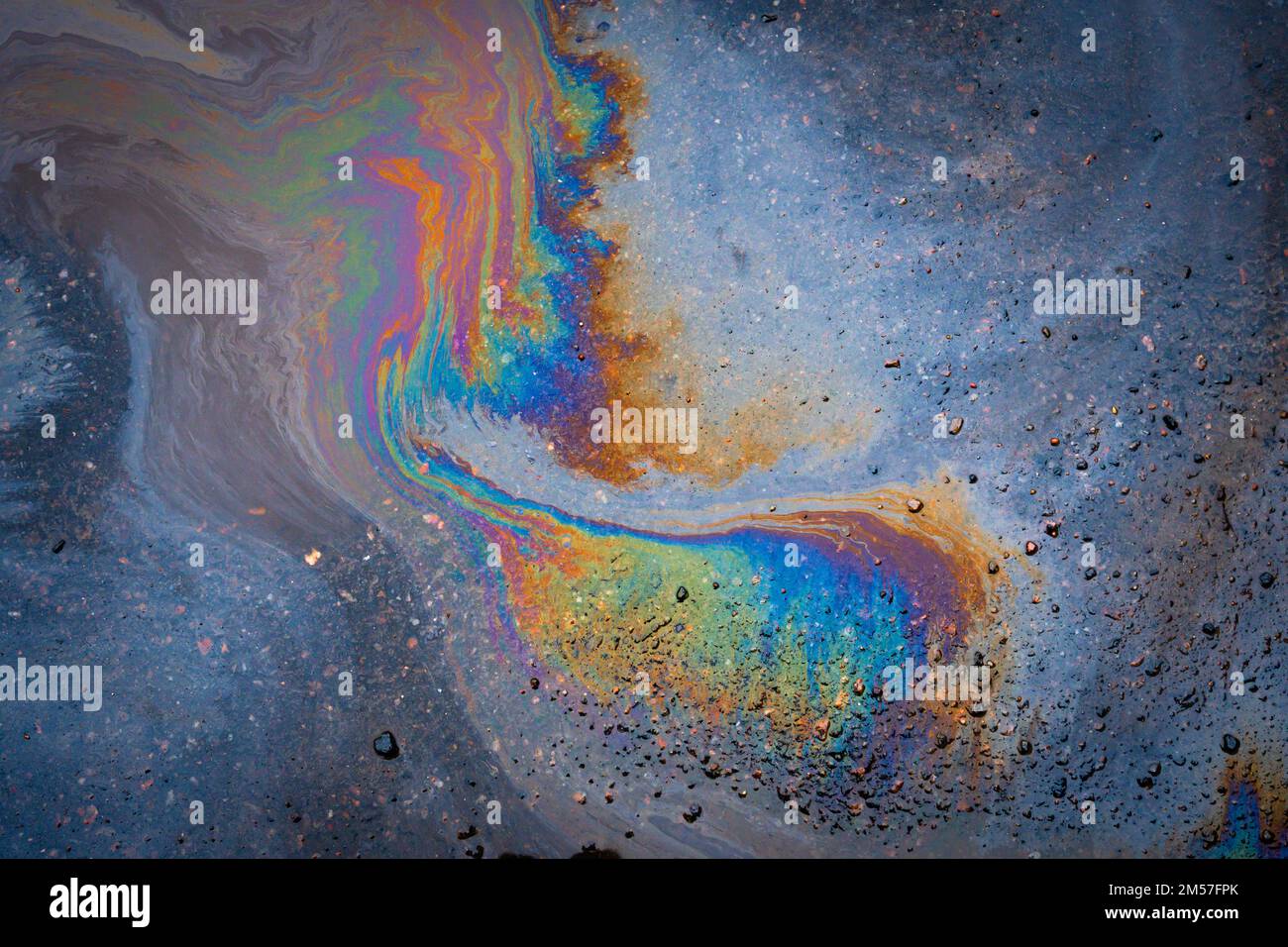 Image of an oil stain on the asphalt of a wet road Stock Photo - Alamy