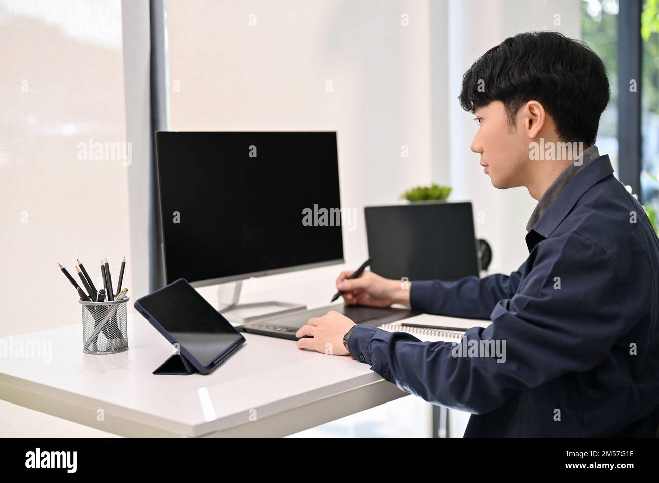 Professional and smart young Asian male website developer or programmer ...