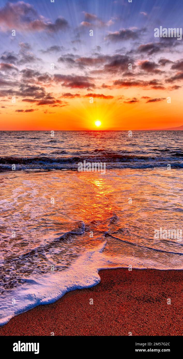 A Sunburst Sunset Against A Colorful Cloudscape Sunset In Vertical ...