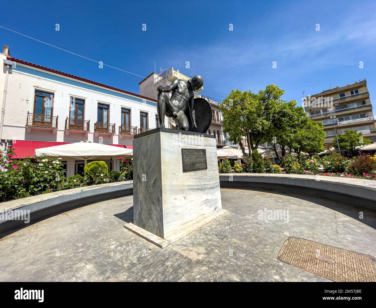 Sculpture of a Spartan warrior in the center of the historical Greek ...