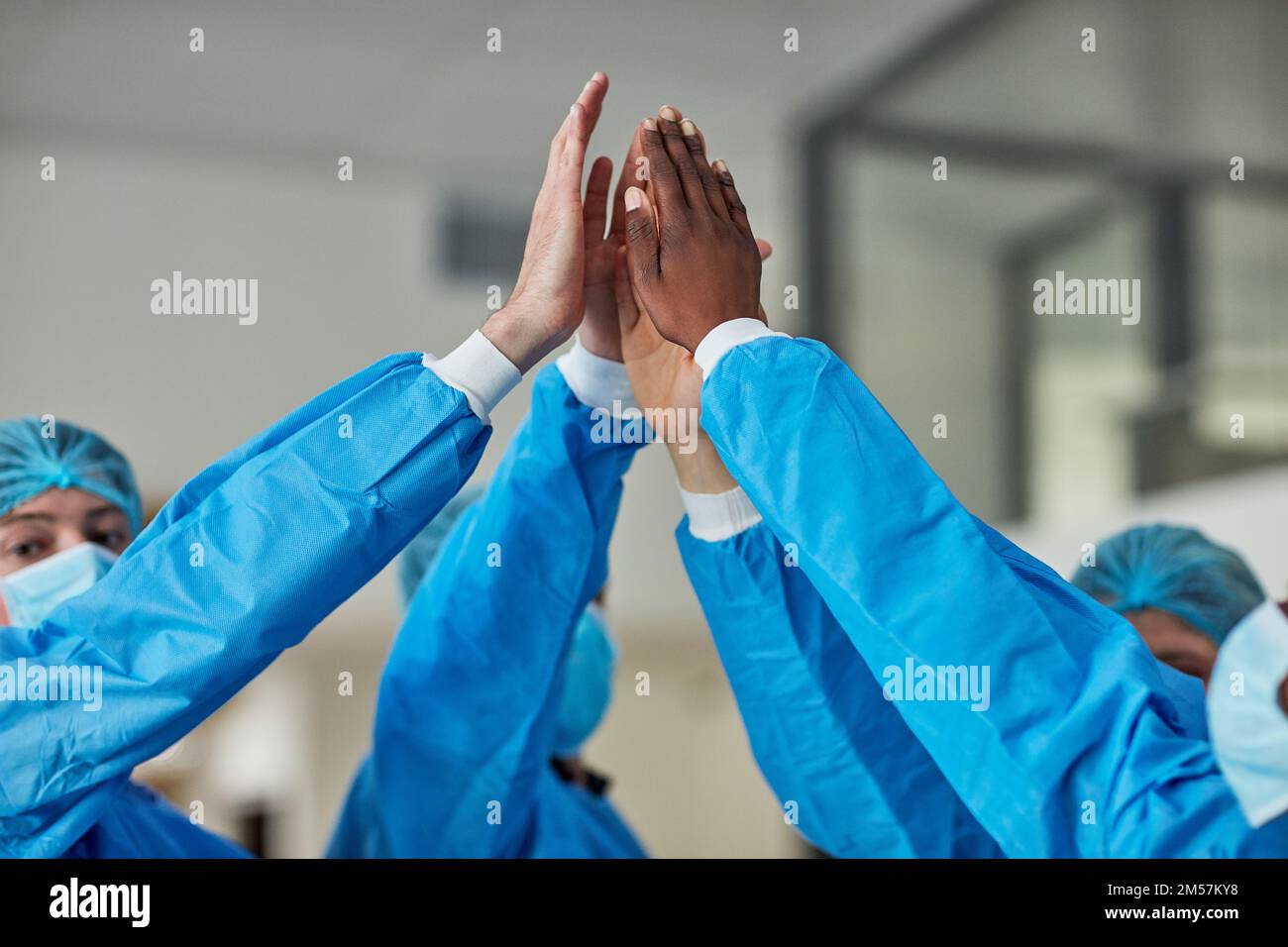 Celebrating another successful surgery. a team of medical practitioners ...