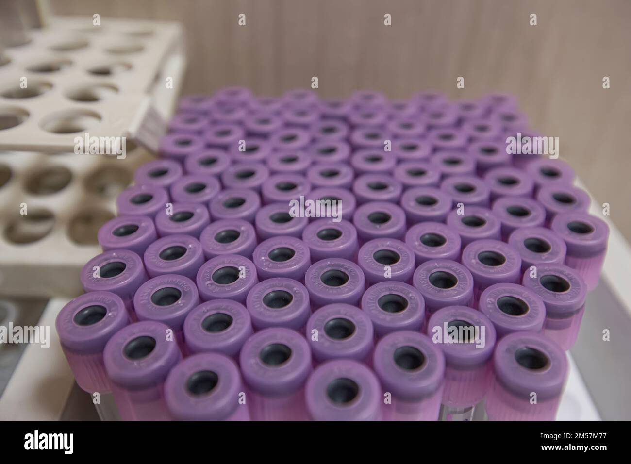 Blood sample tube from a shelf with analysis machines in the laboratory ...