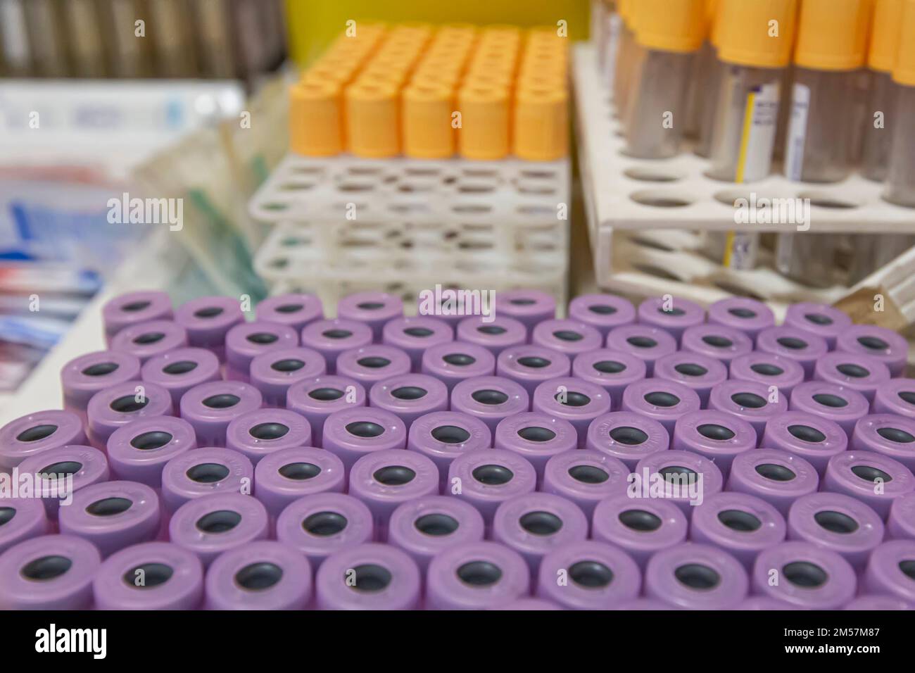 Blood sample tube from a shelf with analysis machines in the laboratory ...