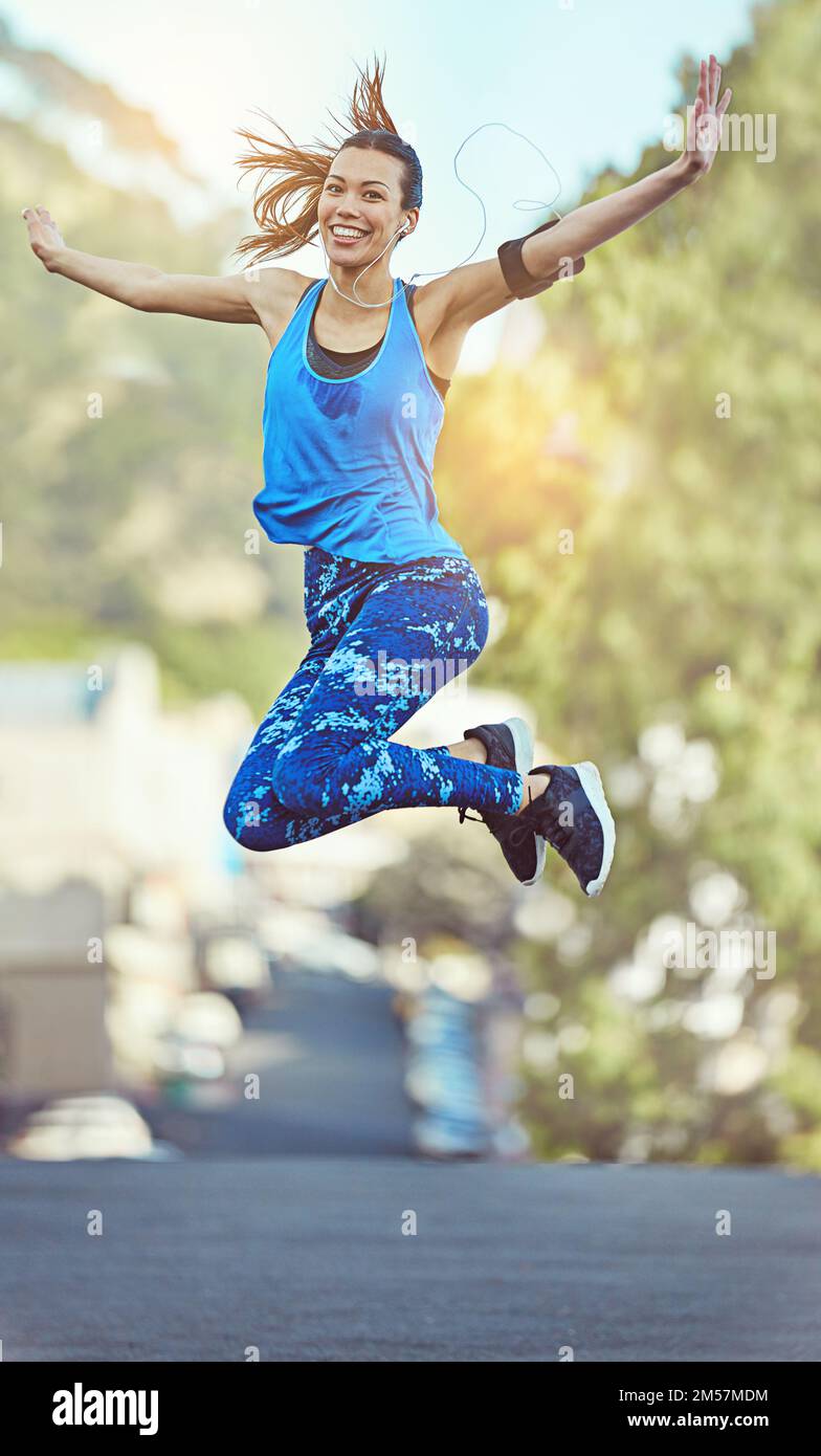 Proving yourself wrong never felt so good. a young woman jumping in mid ...