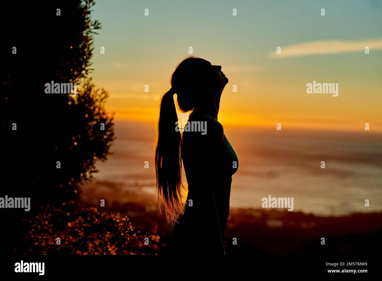 Taking in the fresh air. a young woman taking a break during her ...