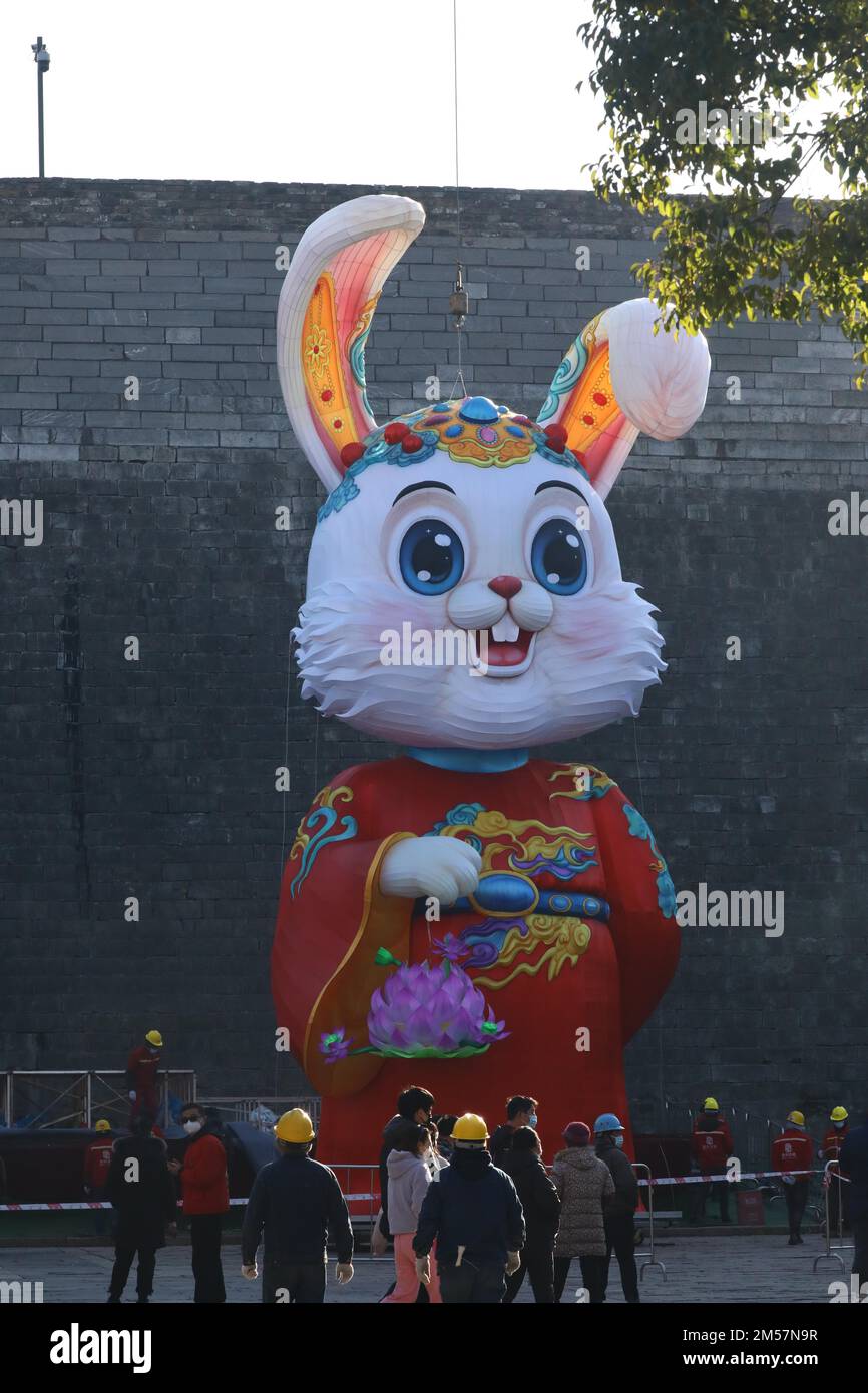 A 15-meter-high giant rabbit in traditional red costume is displayed in ...