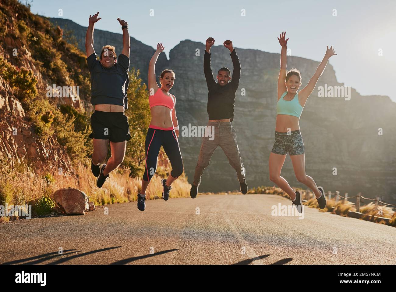Victory belongs to the most persevering. a fitness group celebrating ...