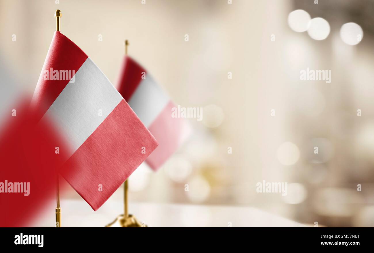 Small flags of the Peru on an abstract blurry background Stock Photo ...