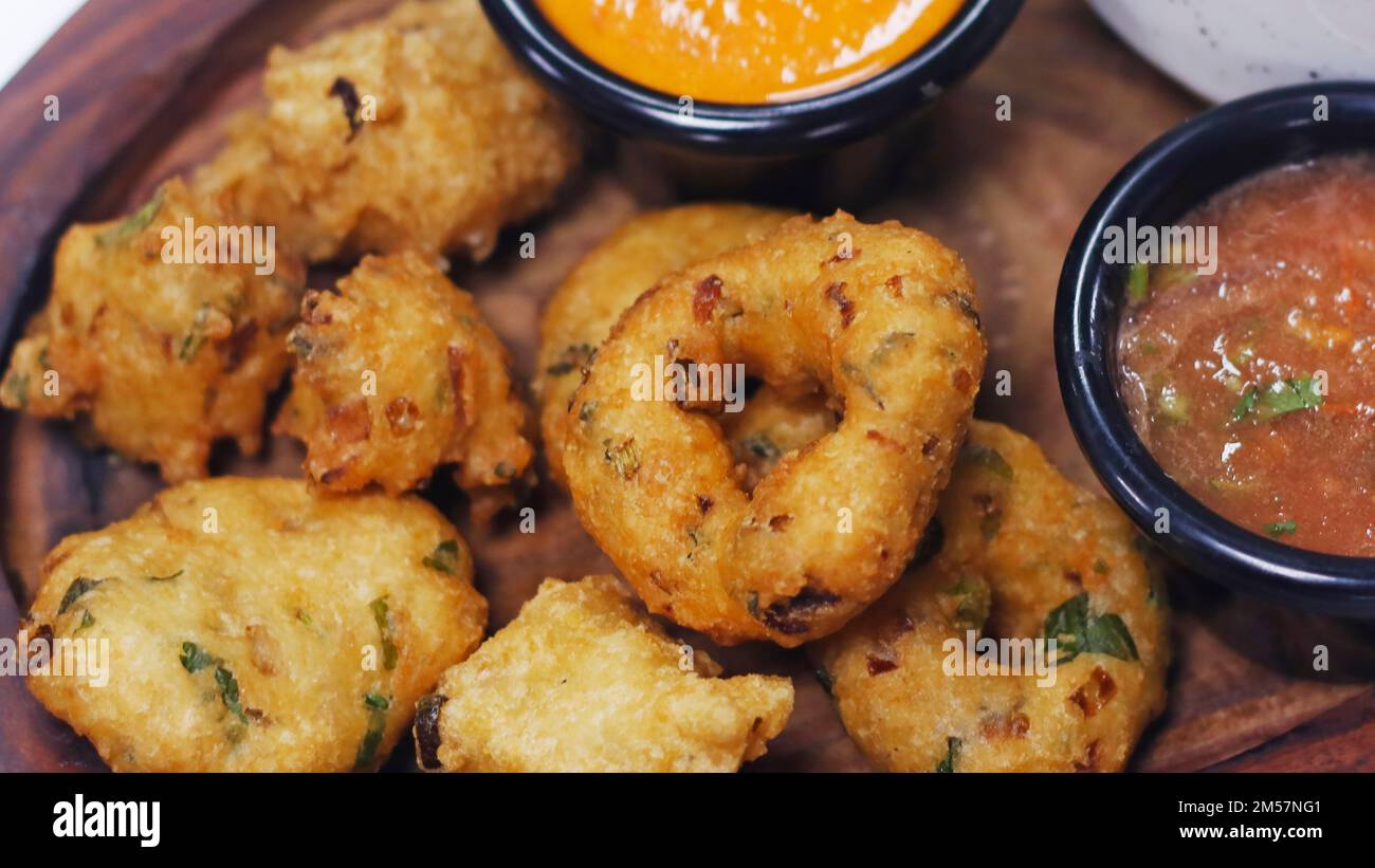 traditional indian snack food, crispy deep fried vada and chutneys ...
