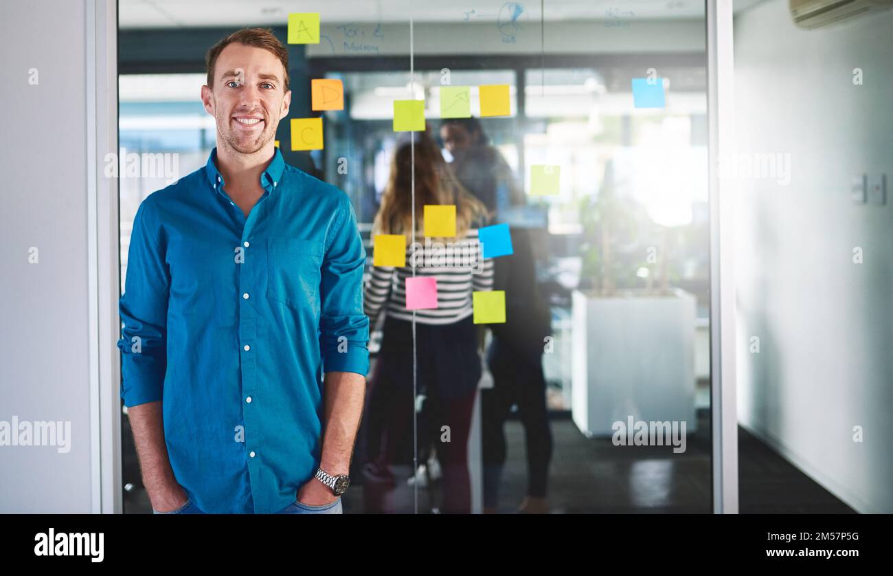 Problem solving is what I do. Portrait of a young man having a ...