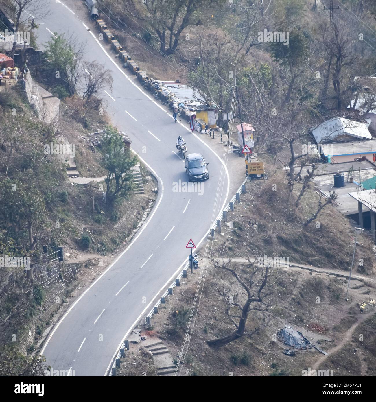 Aerial top view of traffic vehicles driving at mountains roads at ...