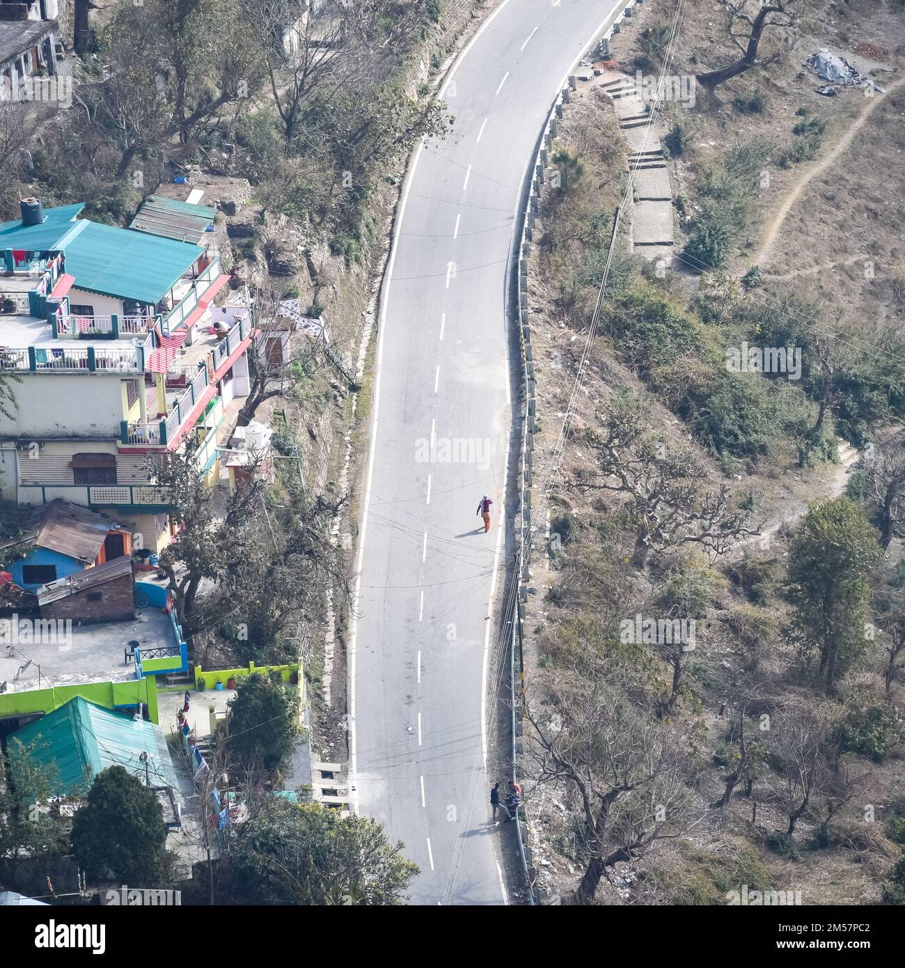 Aerial top view of traffic vehicles driving at mountains roads at ...