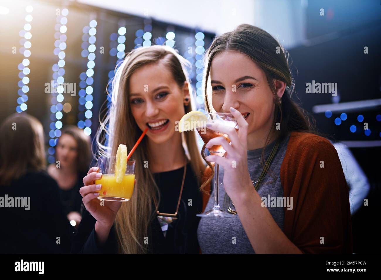 Let The Good Times Roll Portrait Of Two Young Friends Having Drinks