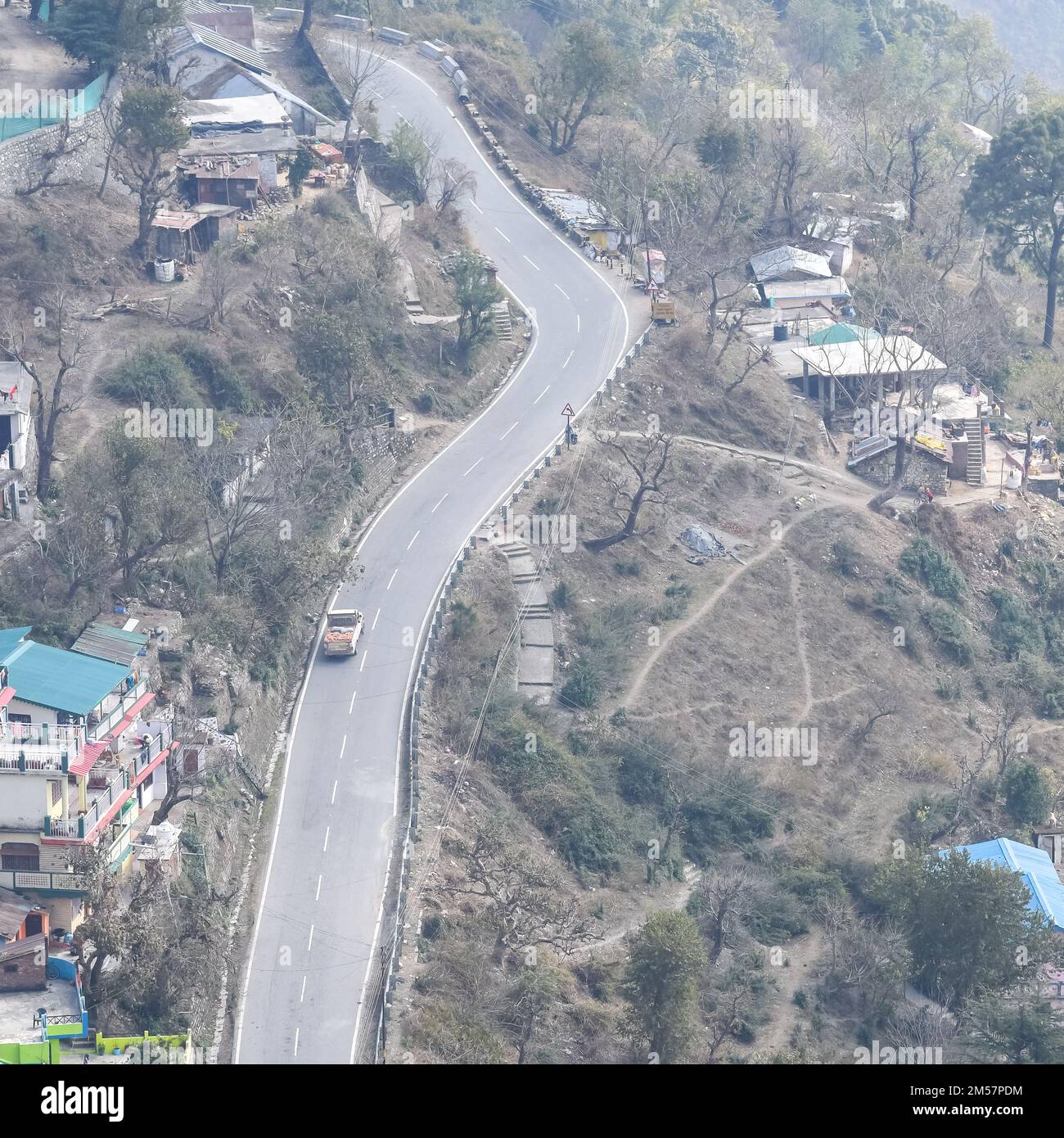 Aerial top view of traffic vehicles driving at mountains roads at ...