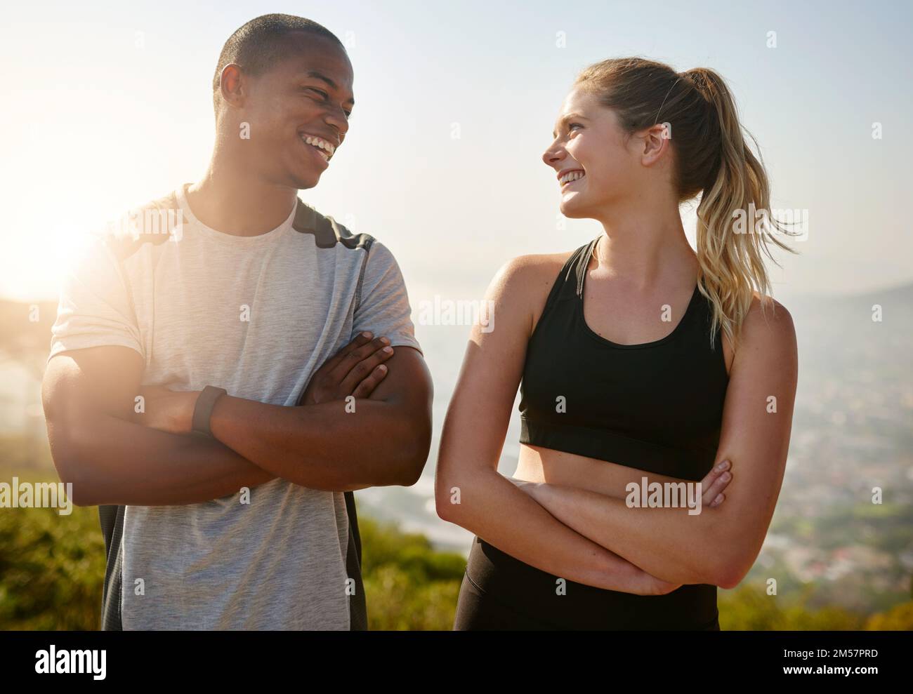 Race you. a fit young couple working out together outdoors Stock Photo ...