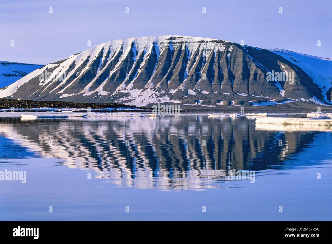 Mountain reflection in water at Svalbard Stock Photo - Alamy