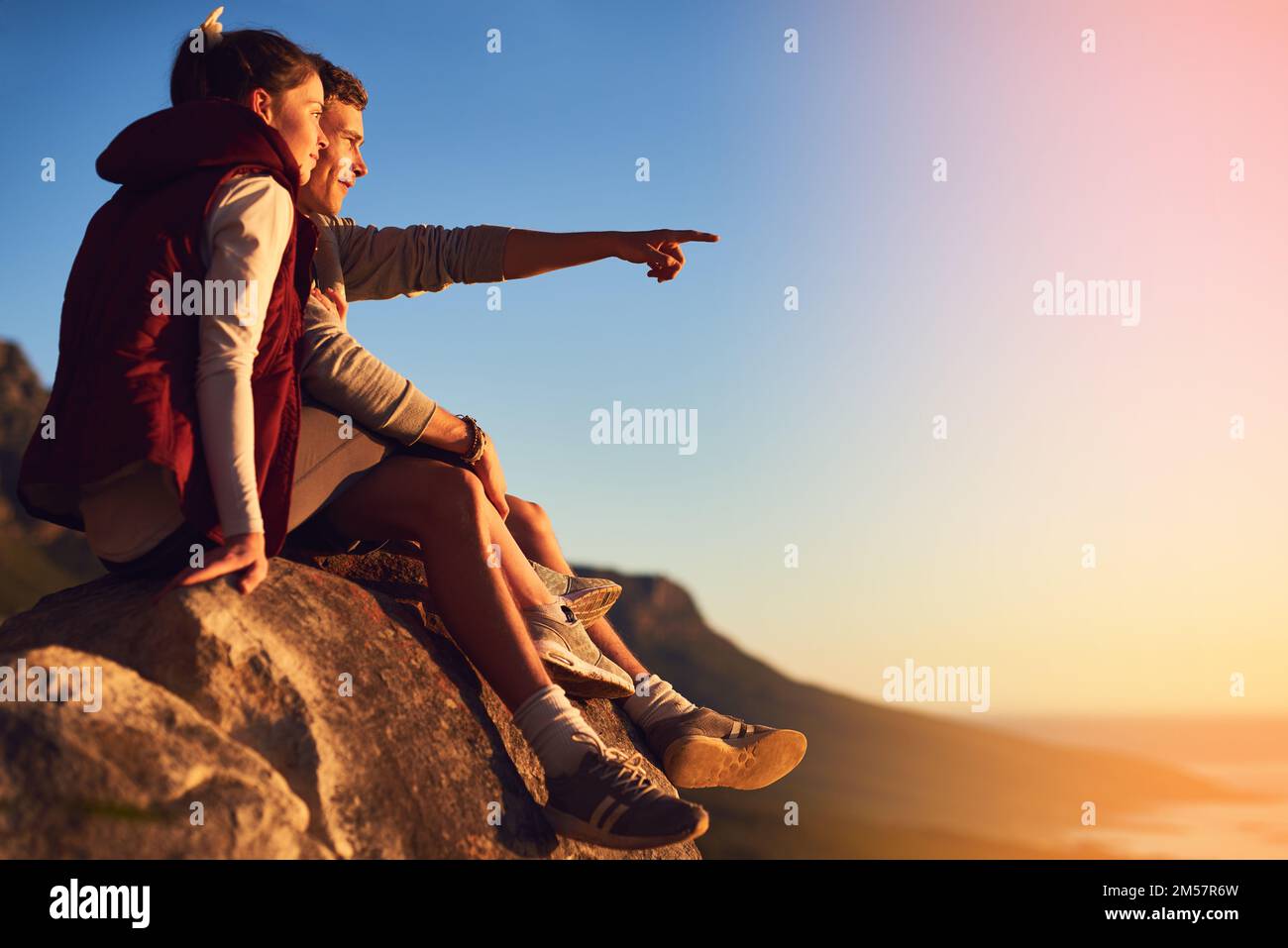 Never lose your sense of wonder. a young couple admiring the view from ...