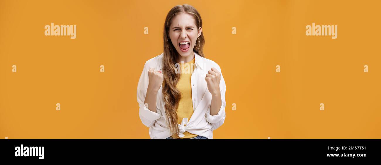 Girl feeling power overcome any trouble yelling to cheer up and boost ...