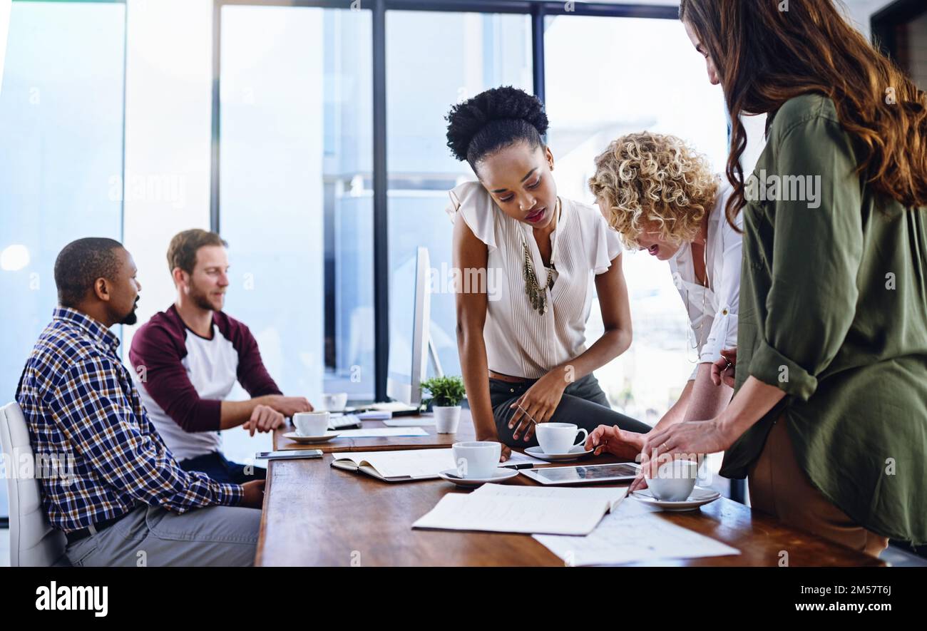 Merging their efforts towards gaining succes. a team of designers ...