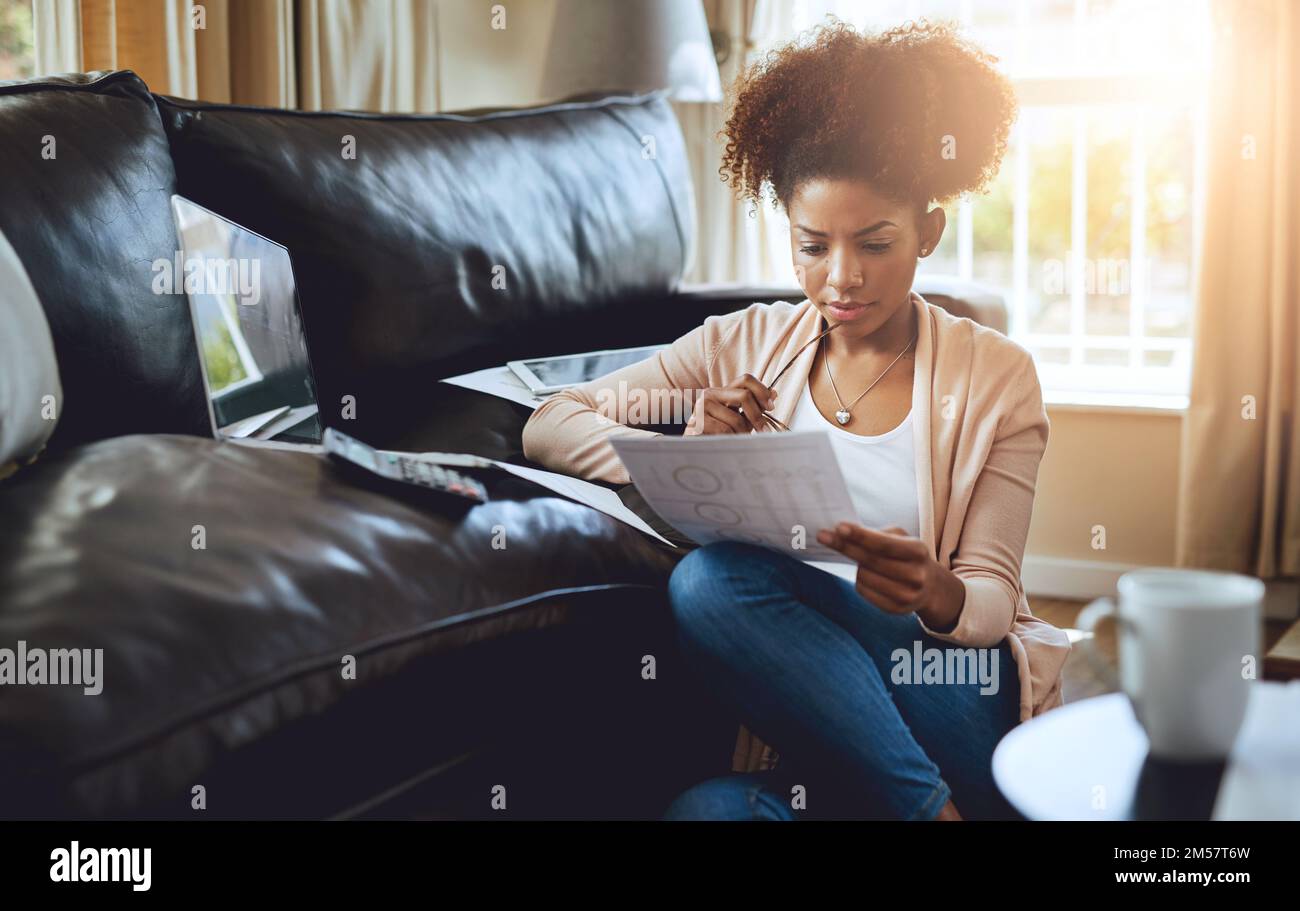 Making her personal paperwork a priority this weekend. a young woman ...