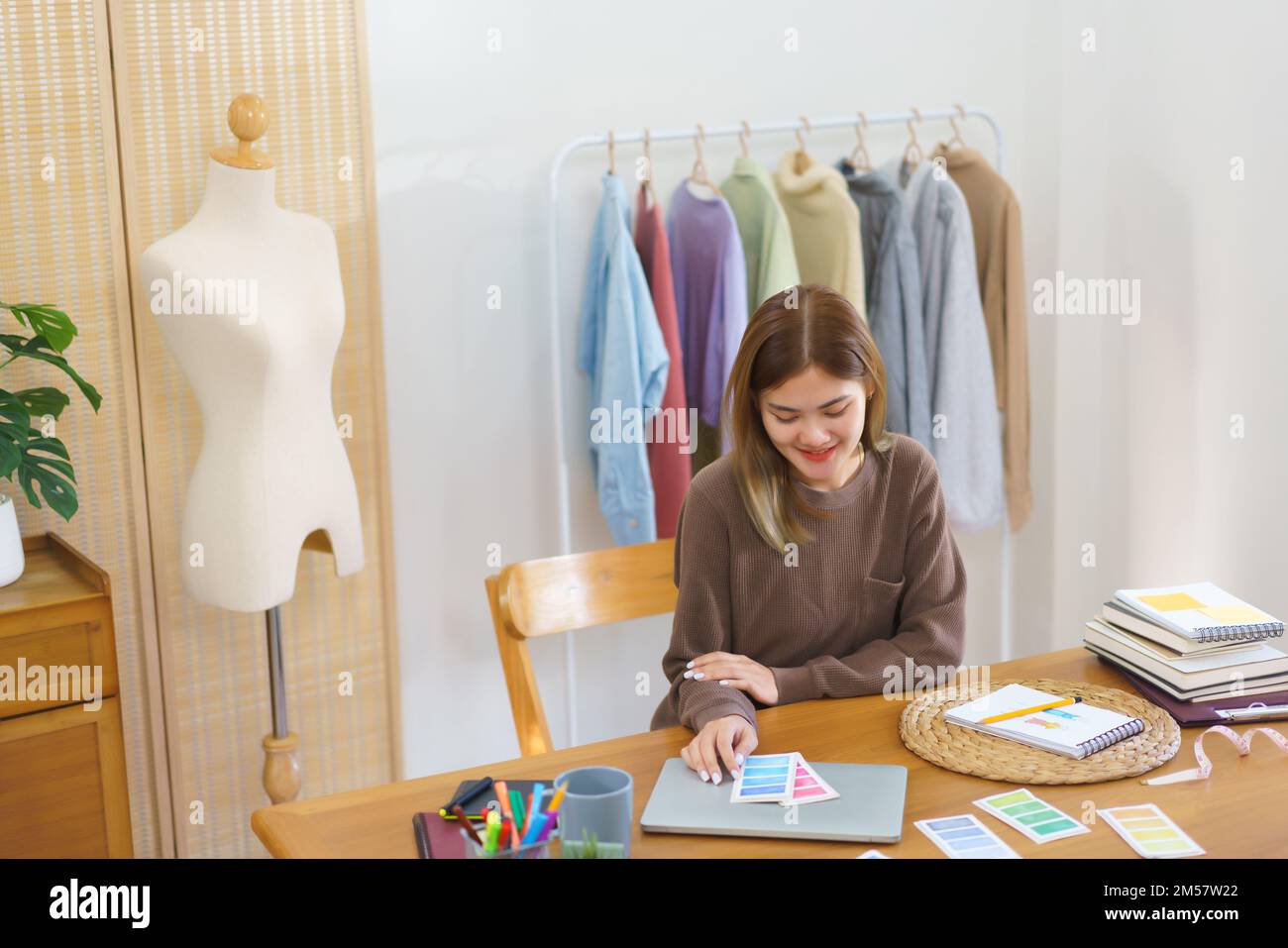 Fashion design concept, Fashion designer sketching and choosing color ...