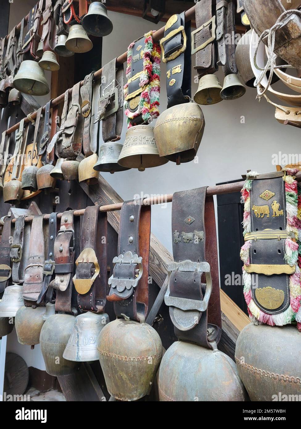 A vertical shot of a store with antique bells and objects in daylight ...